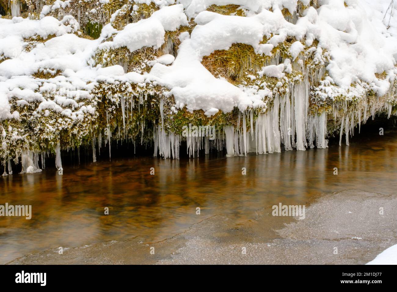 Freshwater limestone outcrop. Raunas Staburags is frozen with icicles ...