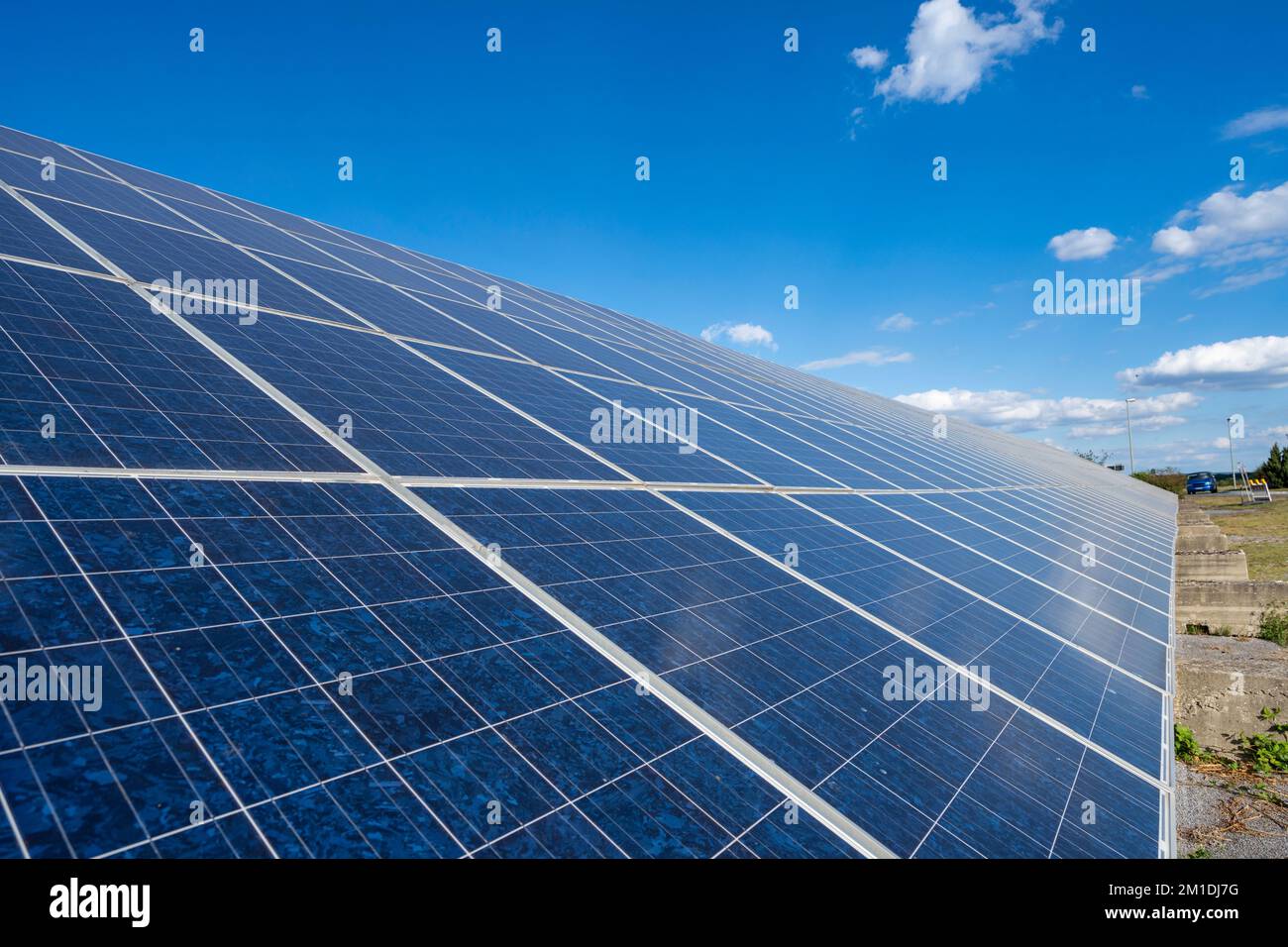 A view of solar panels with reflection sky Stock Photo - Alamy