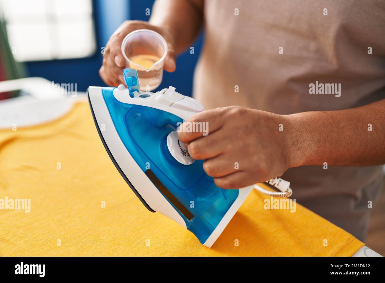 Male hand pouring laundry hi-res stock photography and images - Alamy