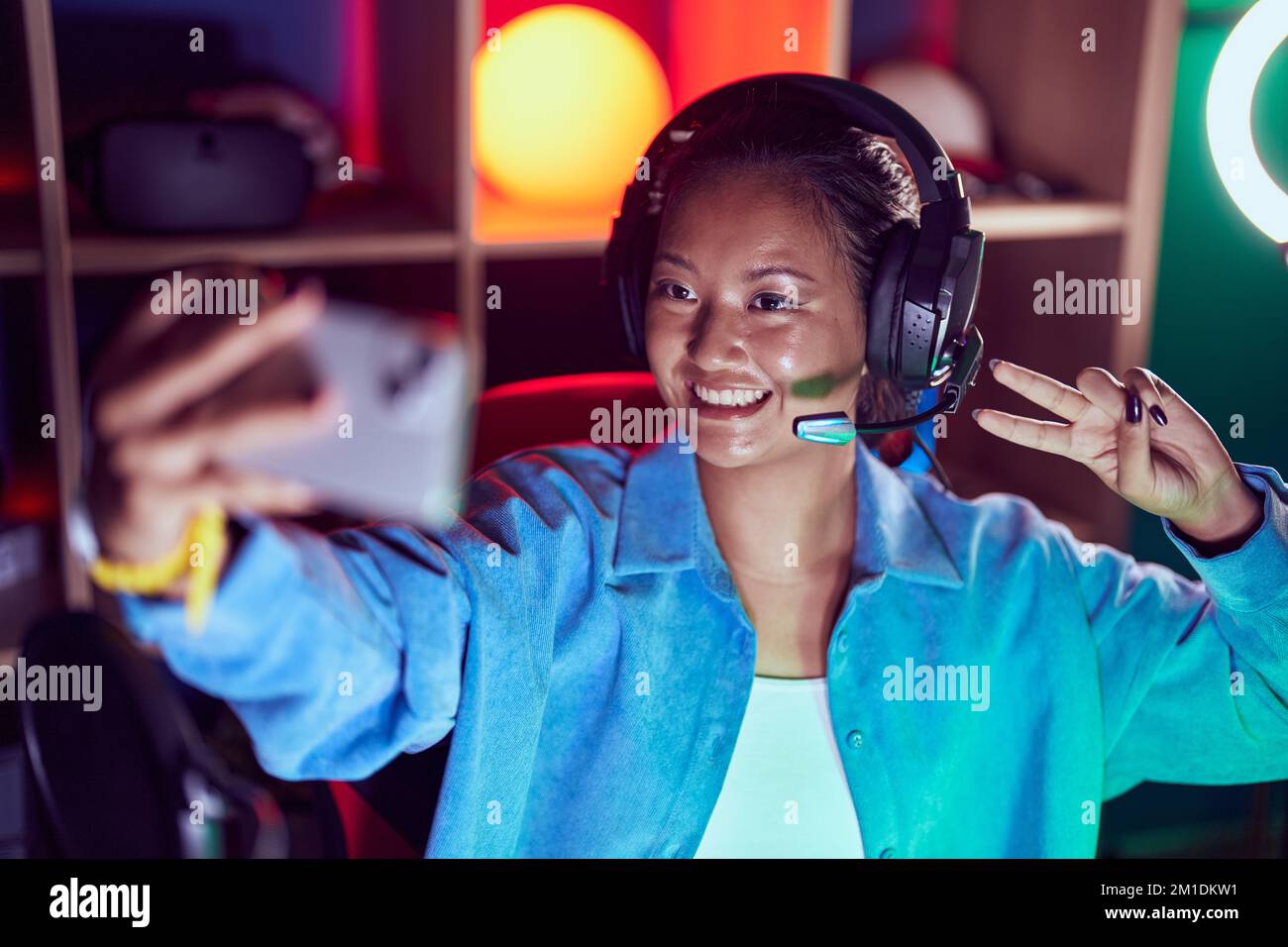 Young chinese woman streamer smiling confident make selfie by ...