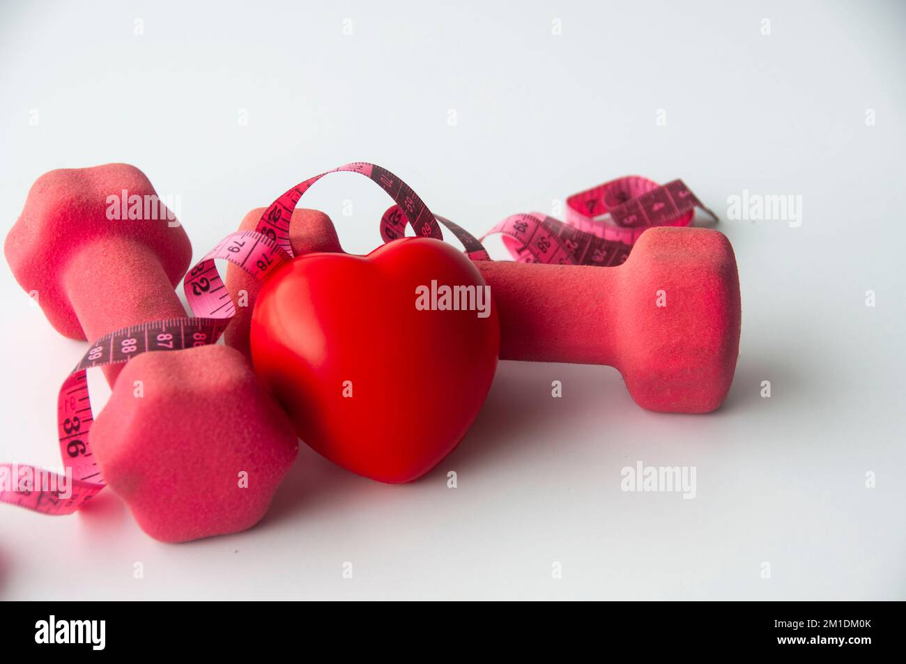 Heart shape with dumbbell on white background cover. Weight loss ...