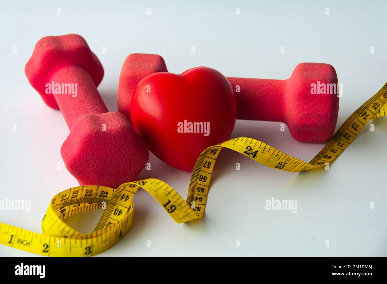 Heart shape with dumbbell on white background cover. Weight loss ...