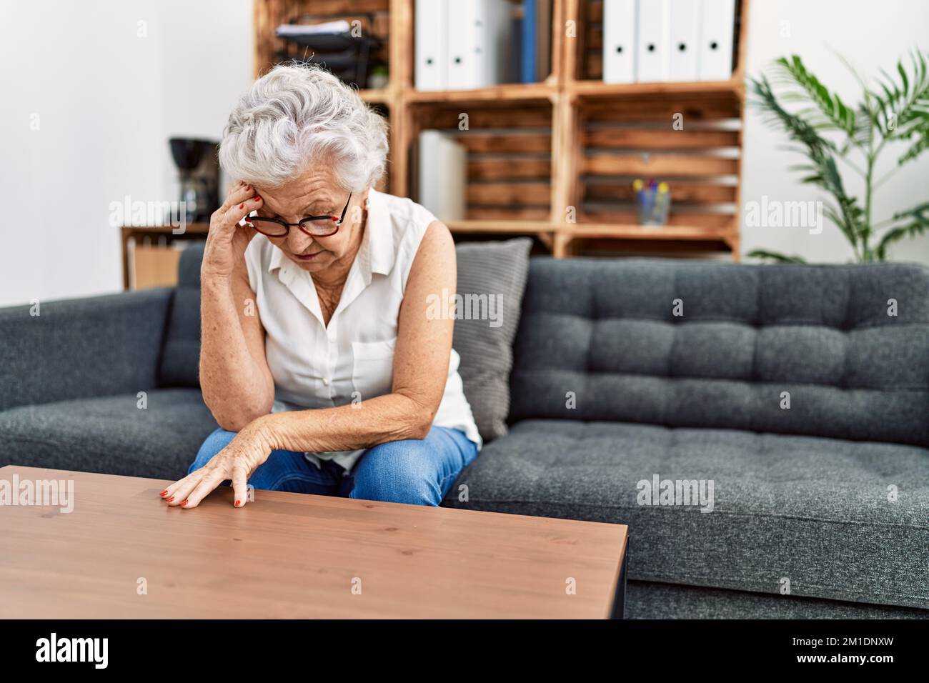 Senior grey-haired woman patient depressed at psychology center Stock ...