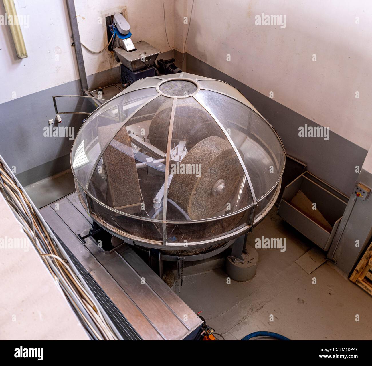 An olive oil factory granite wheel mashing machine equipment Stock ...