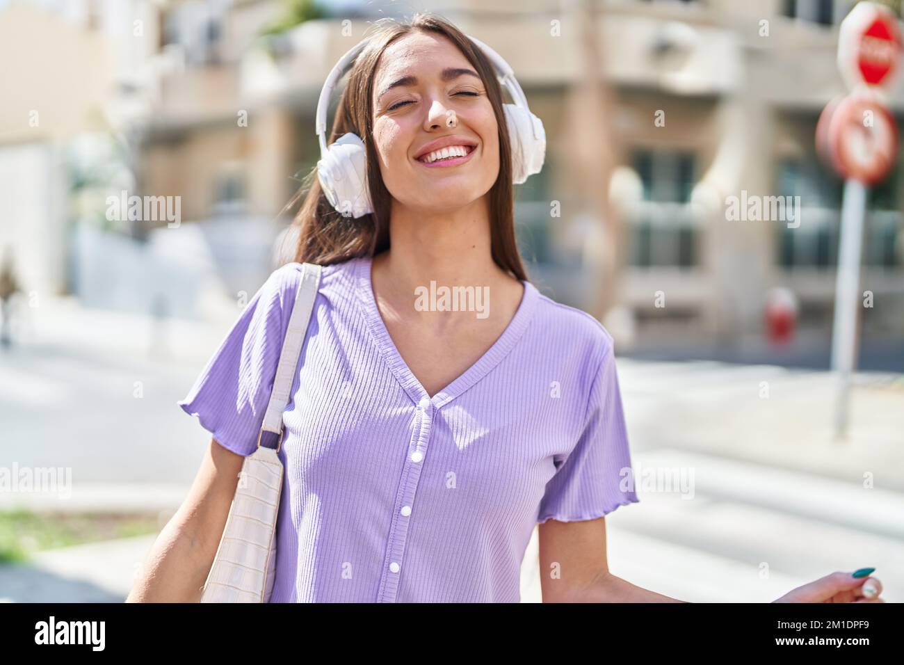 Young beautiful hispanic woman smiling confident listening to music at ...