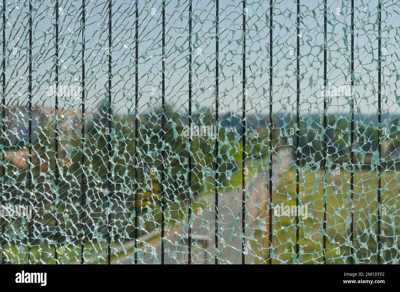 Broken glas of a safety screen along a road crossing a bridge Stock ...