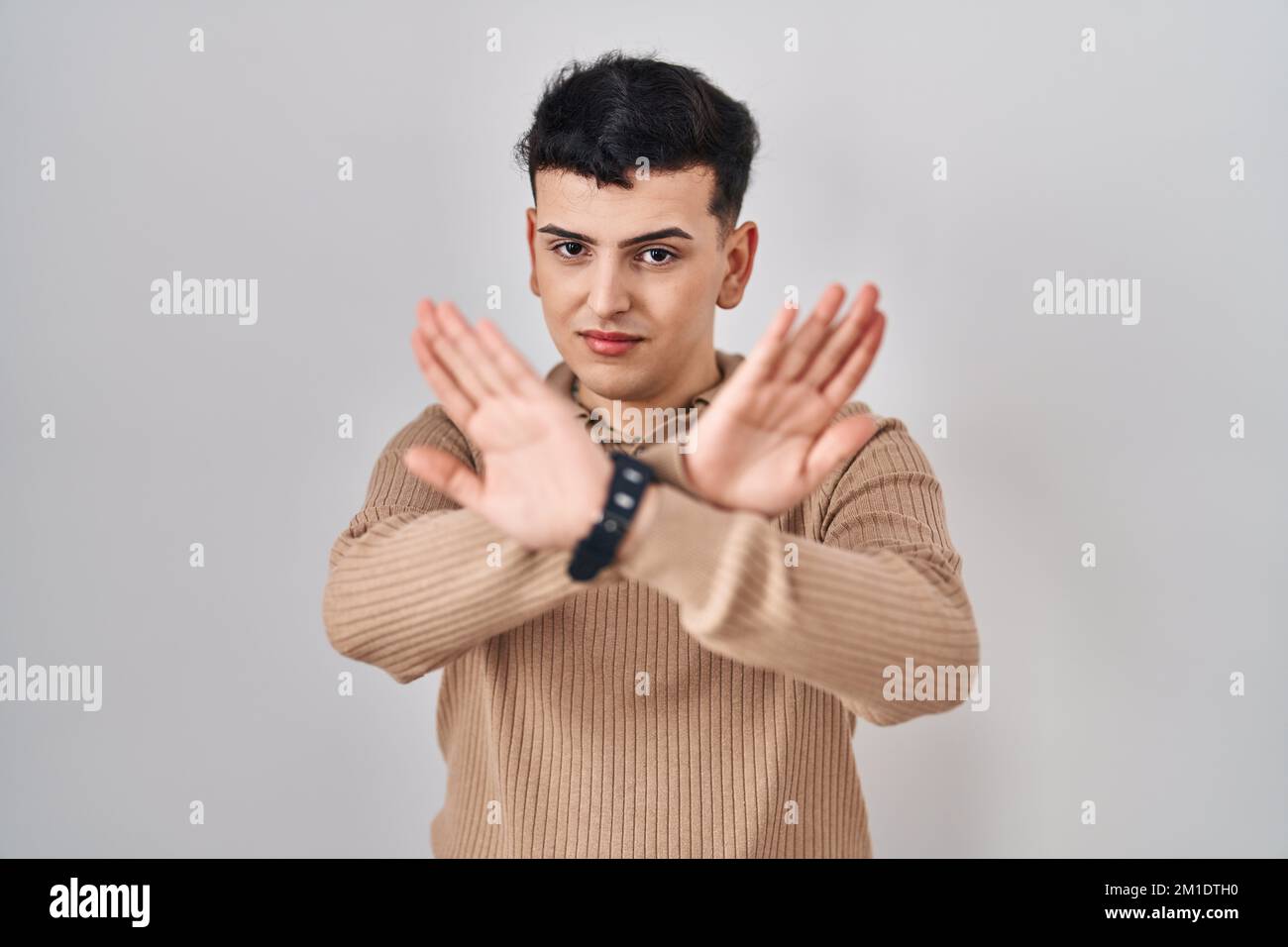 Non binary person standing over isolated background rejection ...