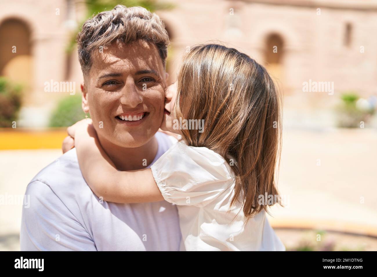 Father and daughter smiling confident hugging each other and kissing at park Stock Photo - Alamy