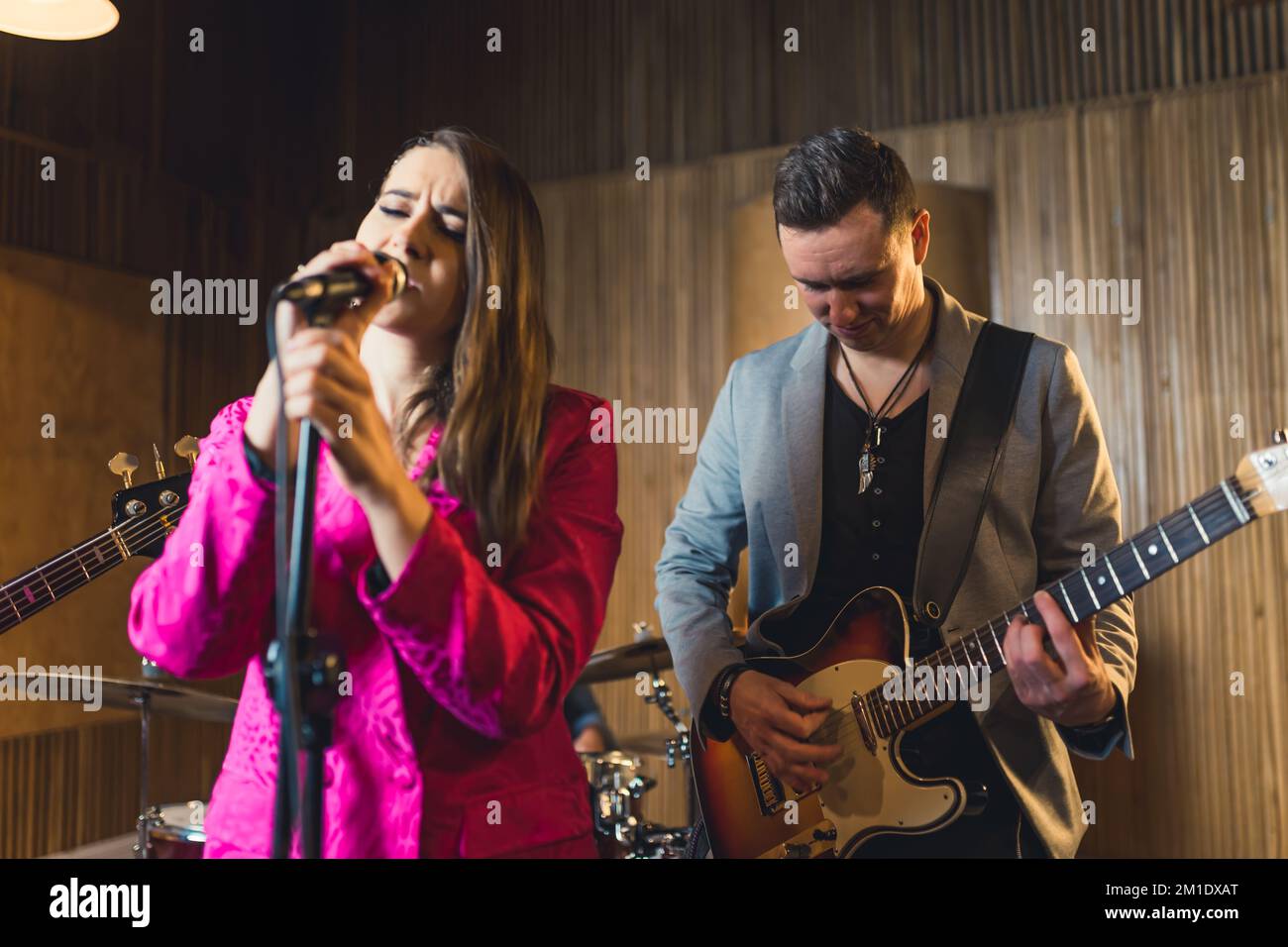Concert duo - caucasian young adult vocalist and mid adult guitarist ...