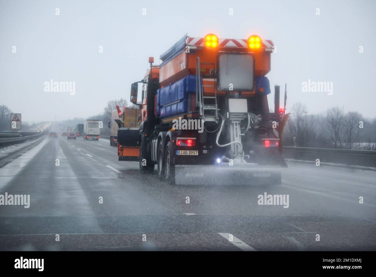 12 December 2022, Saxony, Schkeuditz: A gritting vehicle of the winter ...