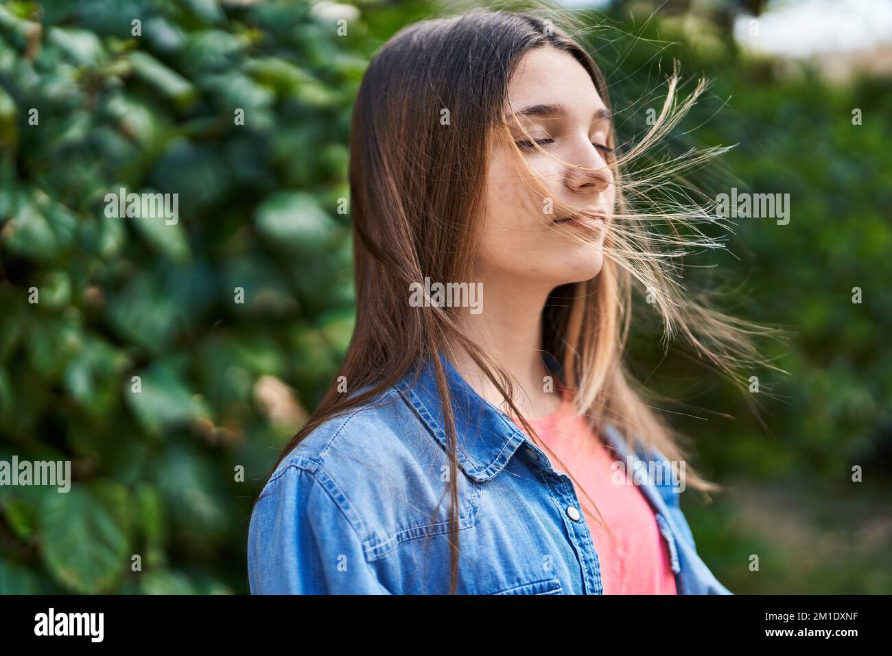 Adorable girl smiling confident breathing at park Stock Photo - Alamy
