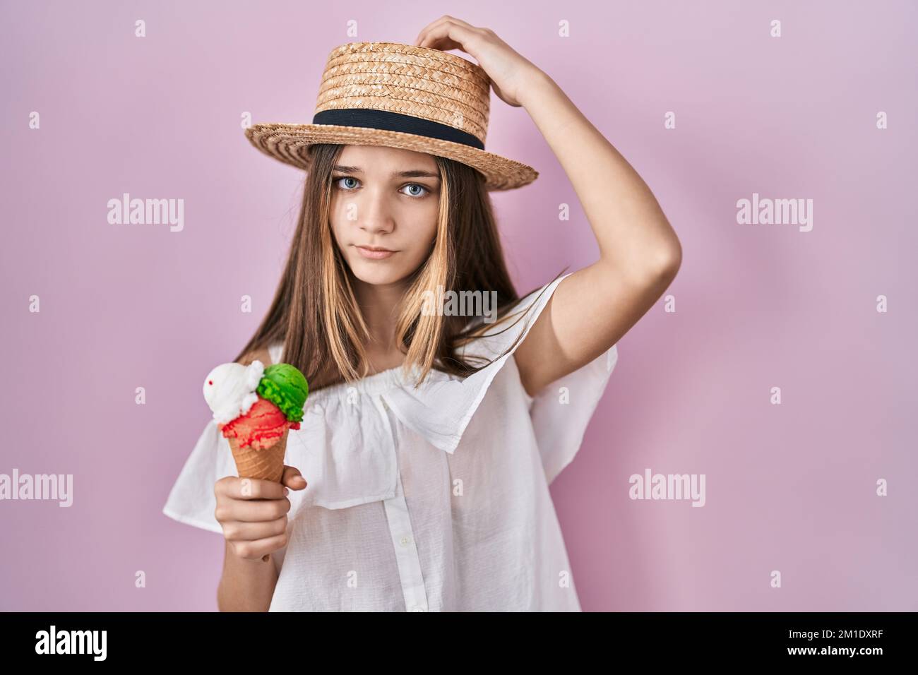 Teenager girl holding ice cream confuse and wondering about question ...