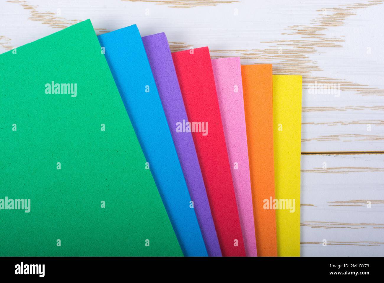 Colorful objects make mixed multi color background Stock Photo - Alamy