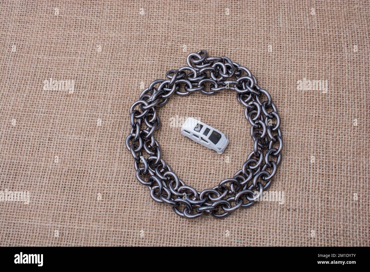 White toy car in a round chain circle on a canvas background Stock ...