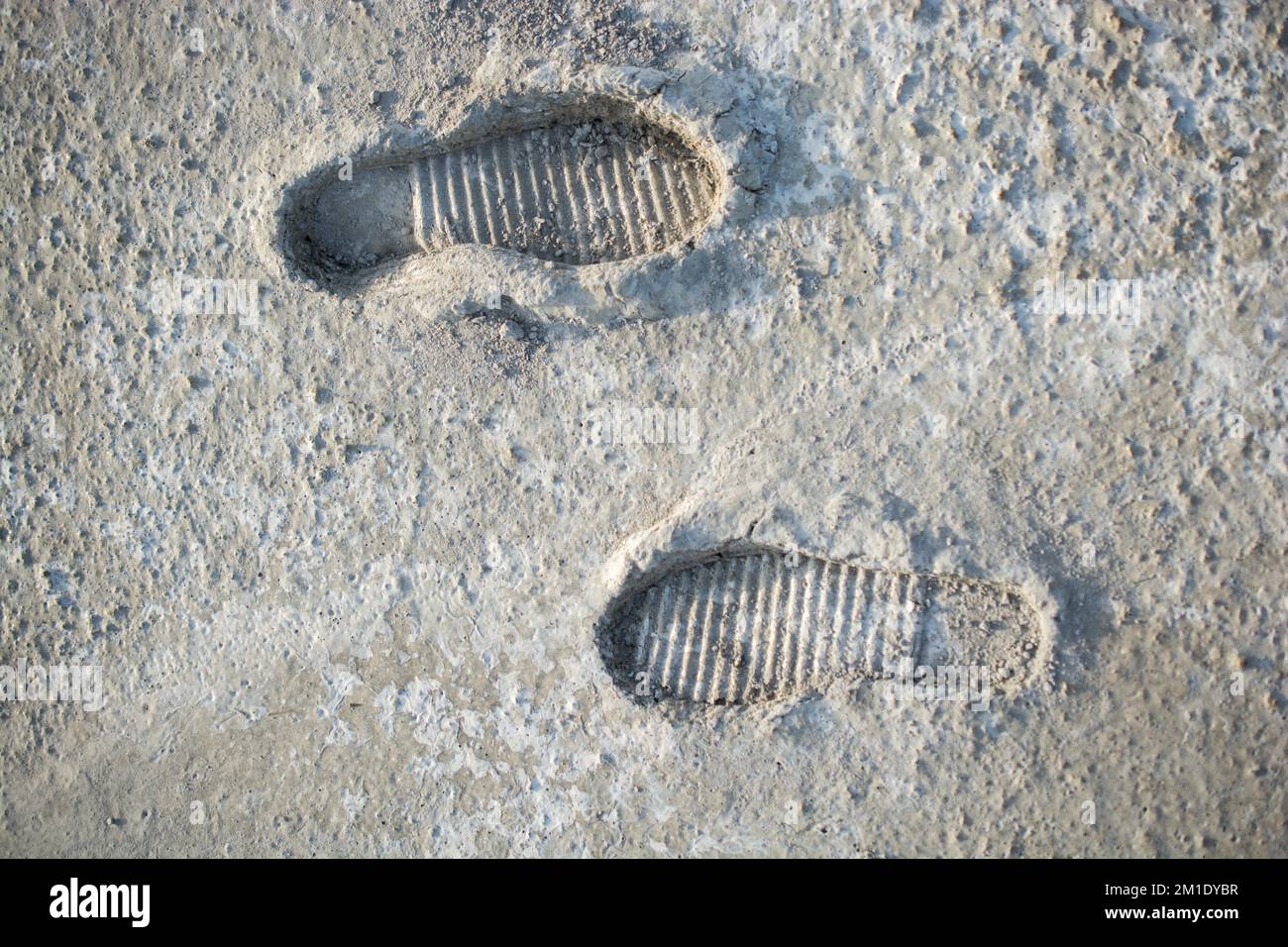 Footstep pattern seen on a concrete background Stock Photo - Alamy