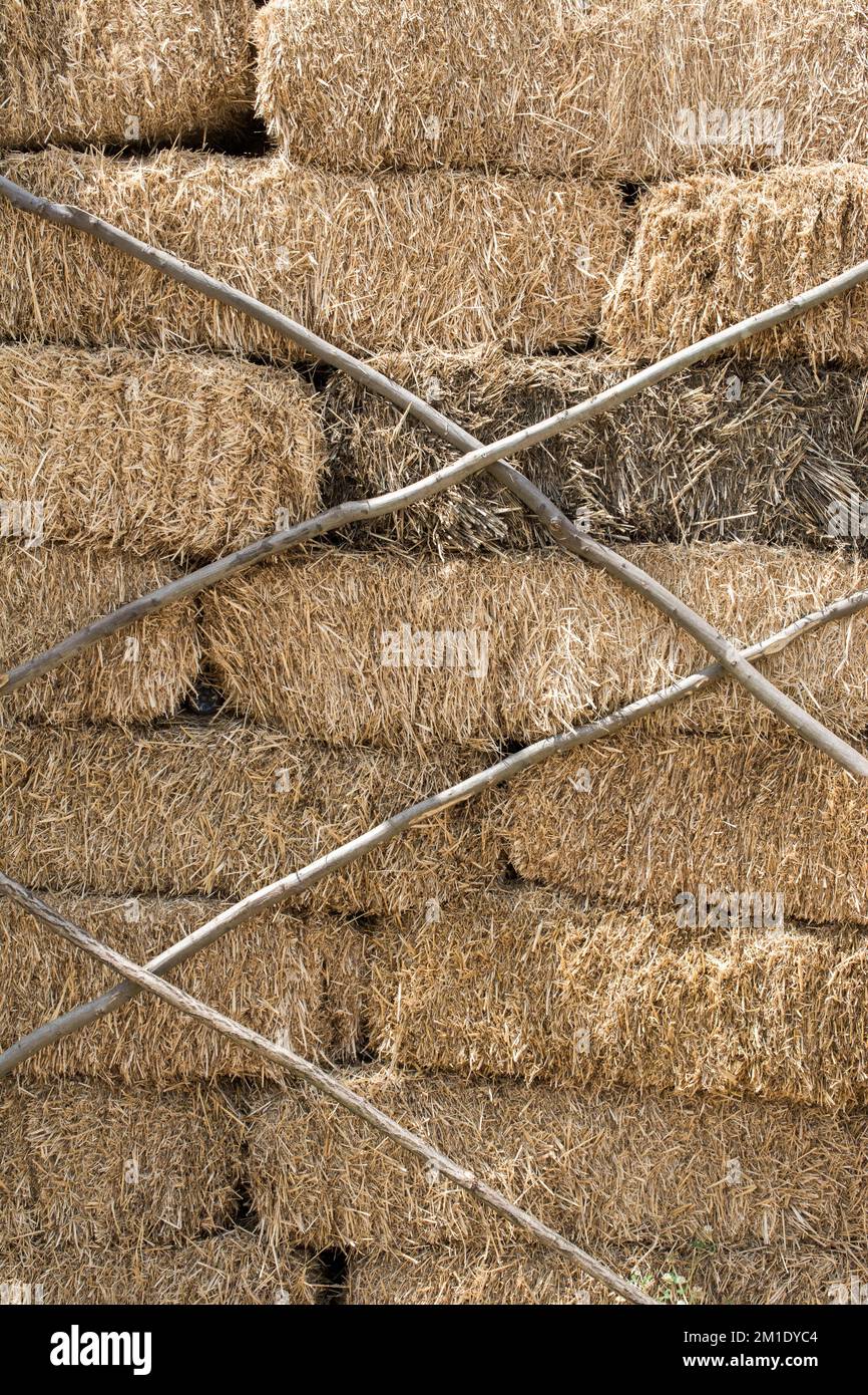 Hay bales stacks outdoors Stock Photo - Alamy