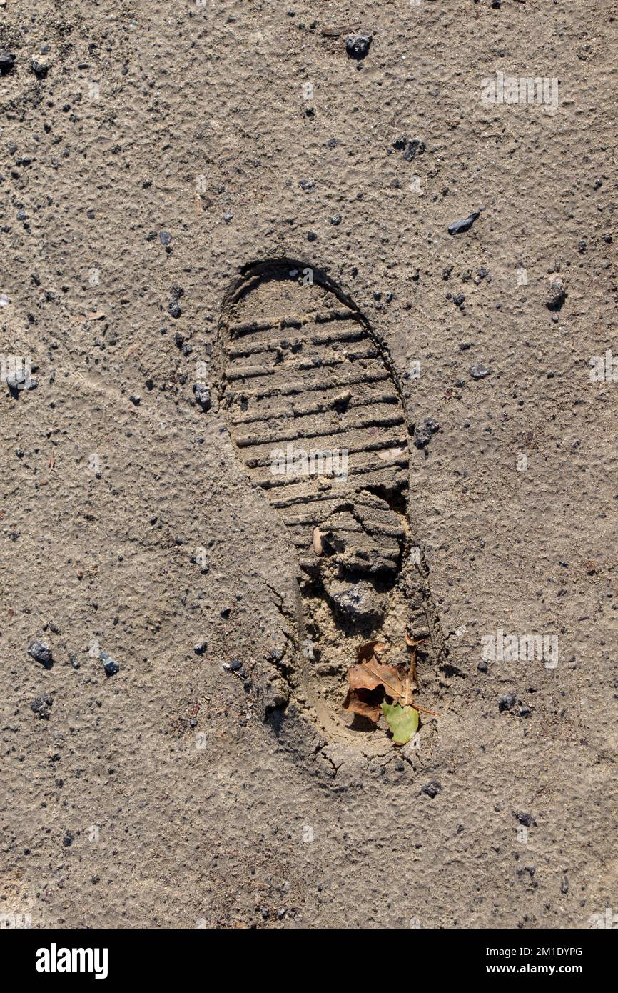 Footstep pattern seen on a concrete background Stock Photo - Alamy