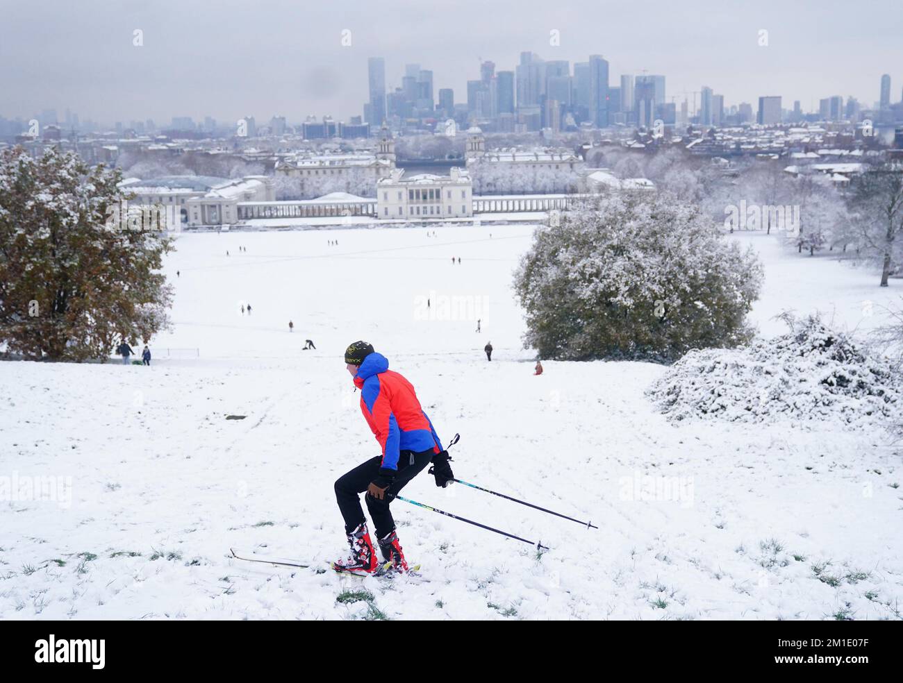 A person skis in the snow at Greenwich Park, London. Snow and ice have ...