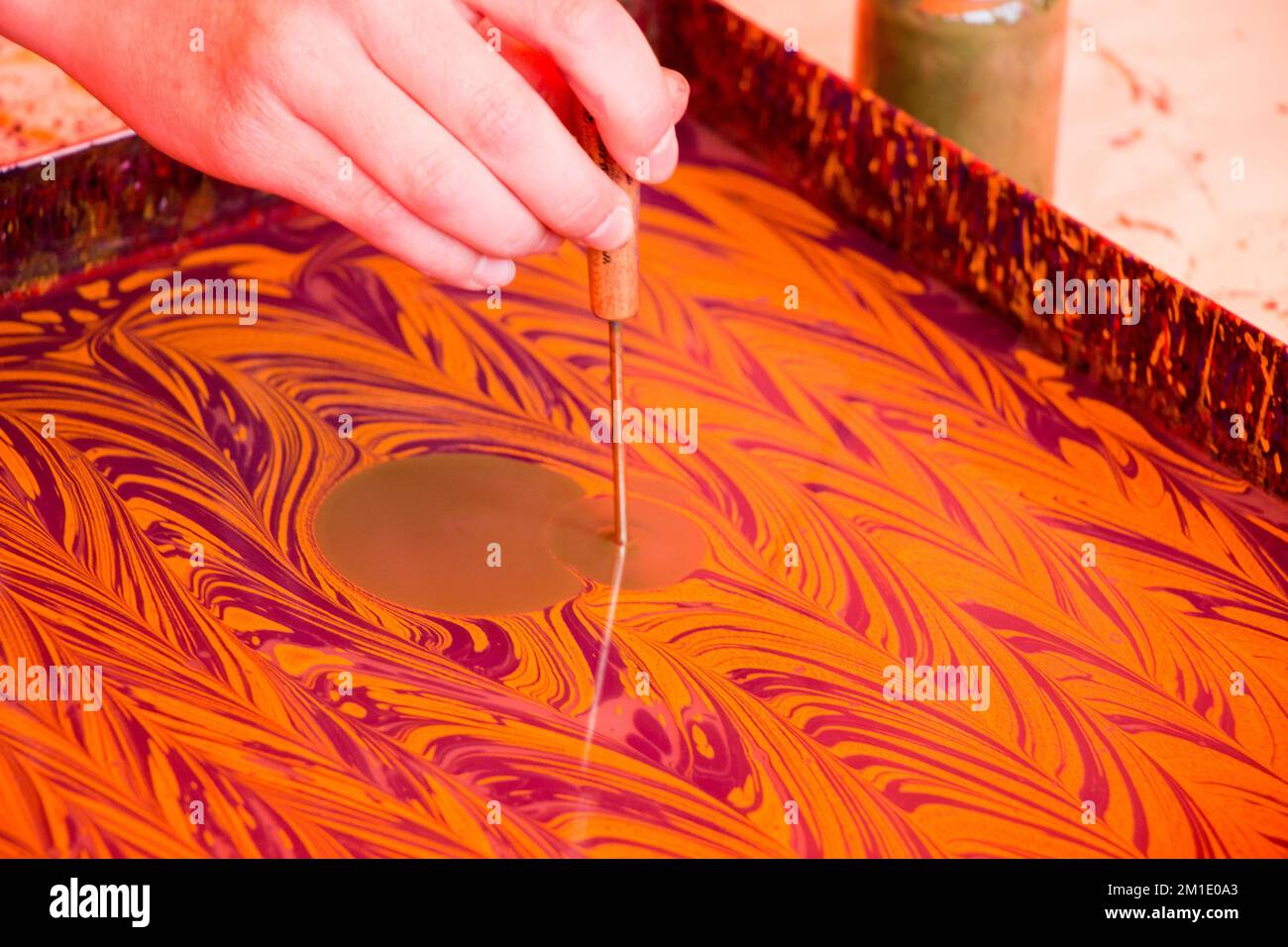 Hand drawing with stick stained inks on water surface Stock Photo - Alamy
