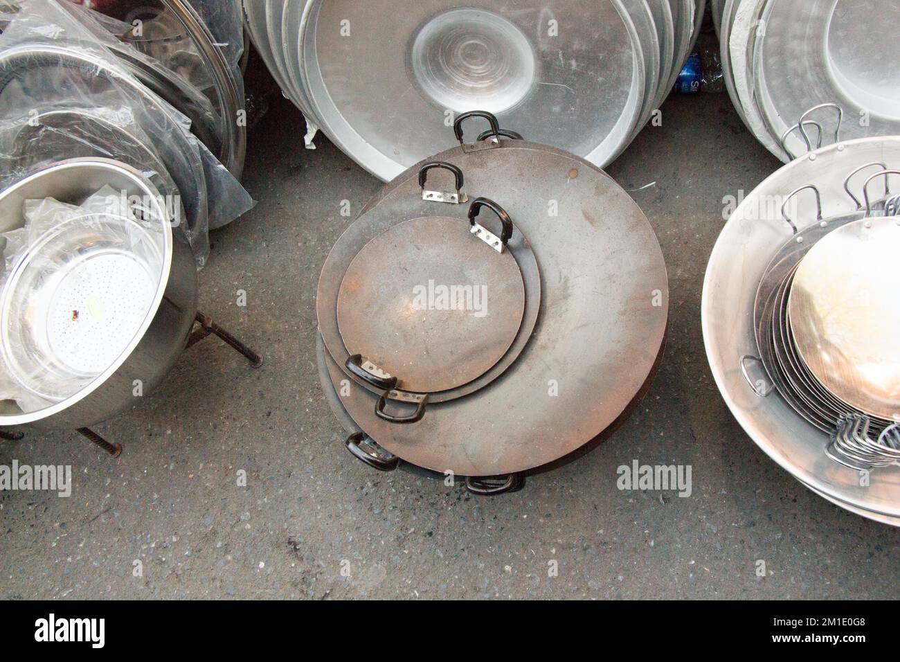 Set of new metal pans as cookware Stock Photo - Alamy