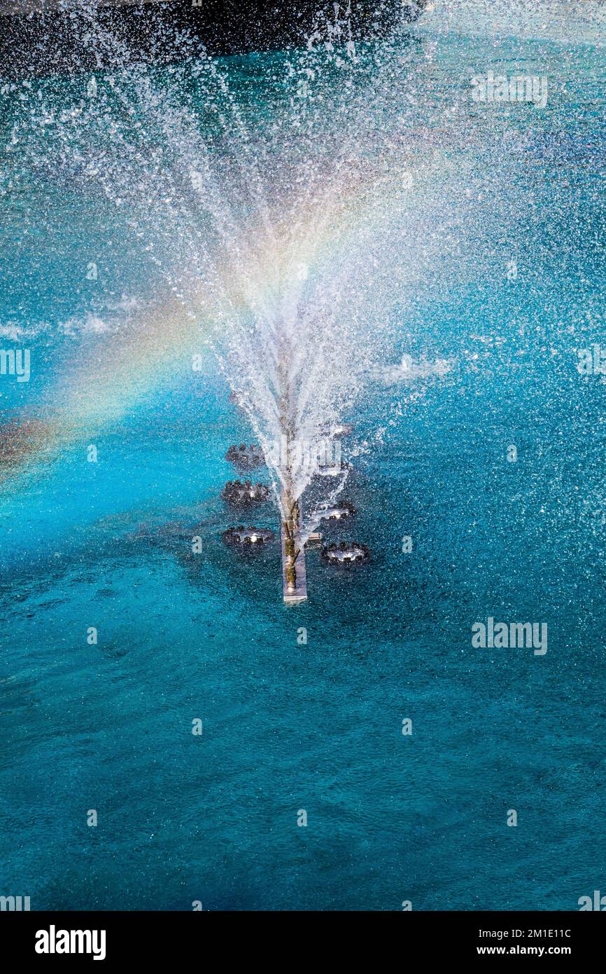 A water fountain sprinkling water in the view Stock Photo - Alamy