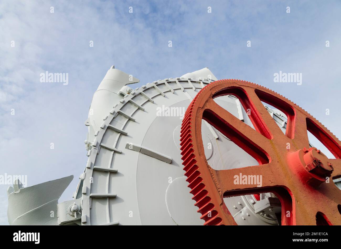 Grey bucket-wheel excavator with red cog wheel Stock Photo - Alamy