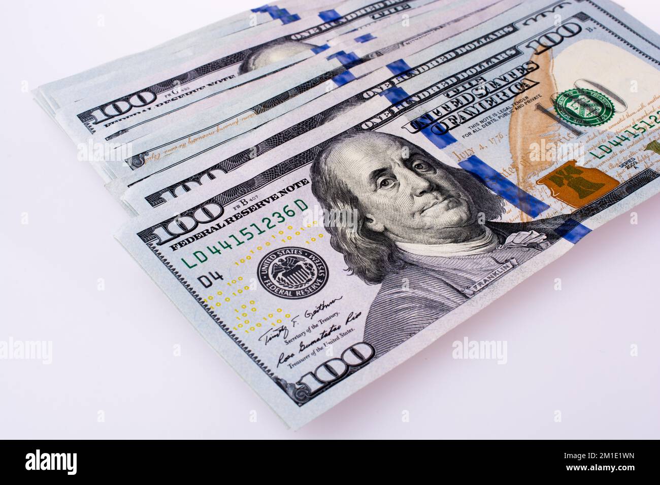 American 100 dollar banknotes made of paper placed on white background ...