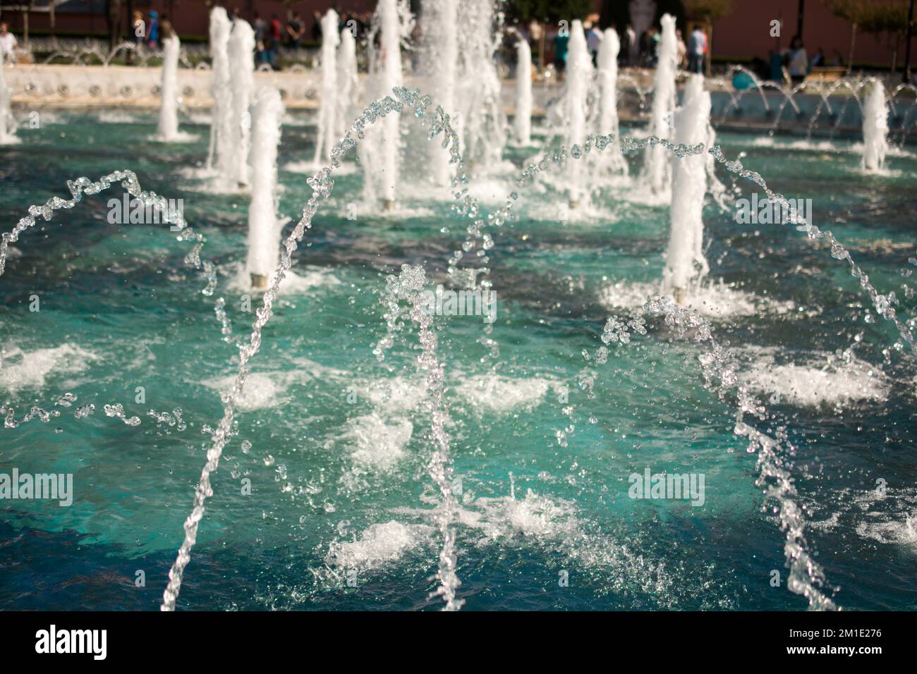 The fountains gushing sparkling water in a pool in a park Stock Photo ...