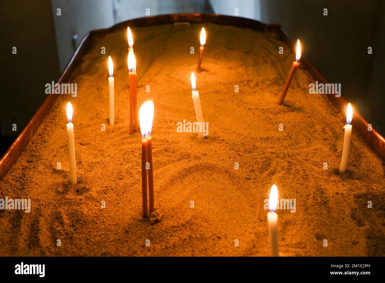 Candles burning over dark background in a church Stock Photo - Alamy