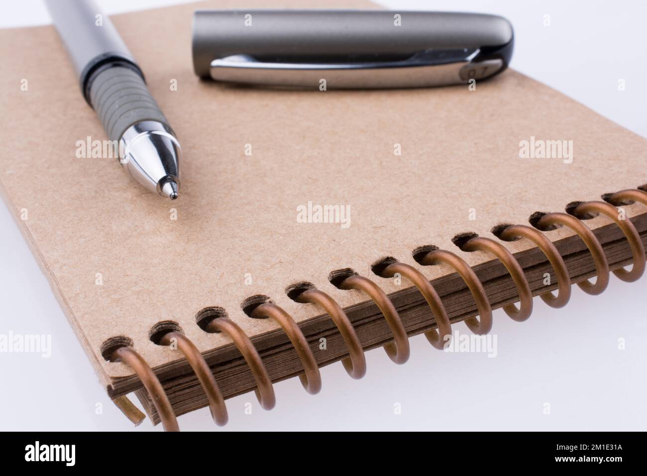 Pen on a spiral notebook Stock Photo - Alamy