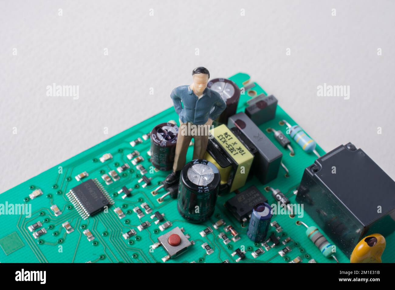 Tiny figurine of men model on Circuit board of electronics Stock Photo ...