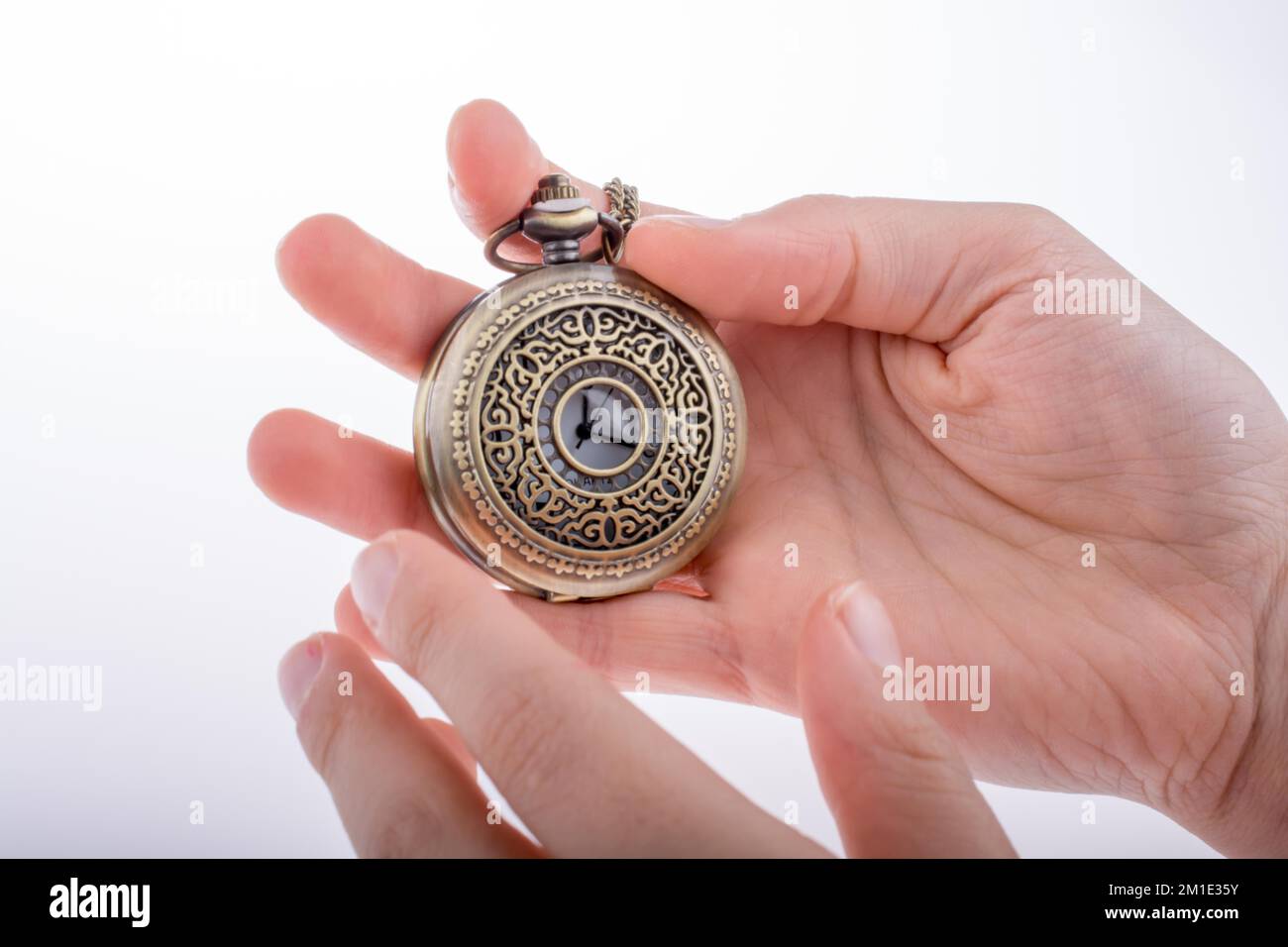 Hand holding a retro styled pocket watch in hand Stock Photo - Alamy