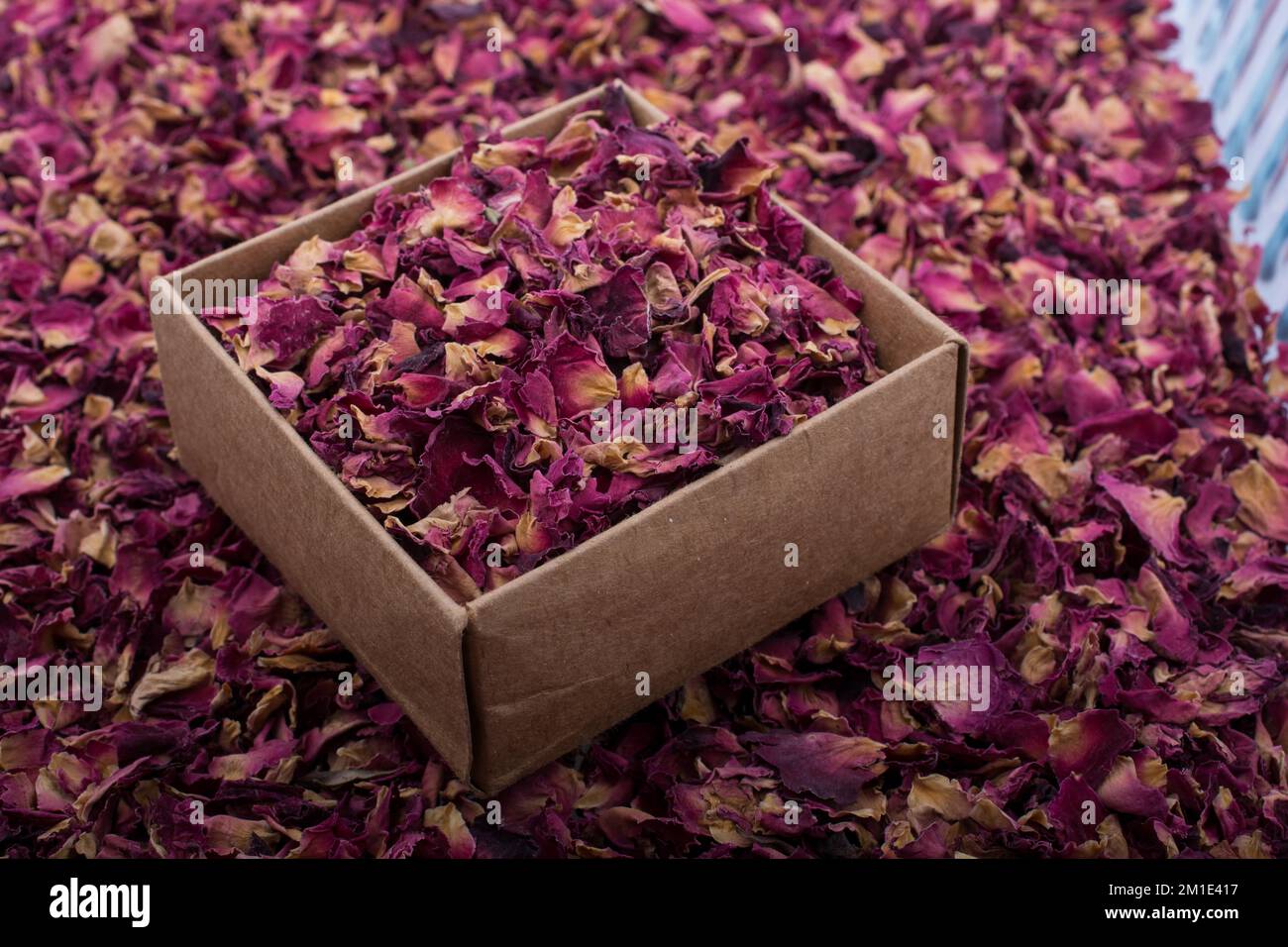 Dried rose petals in box and as a background Stock Photo - Alamy