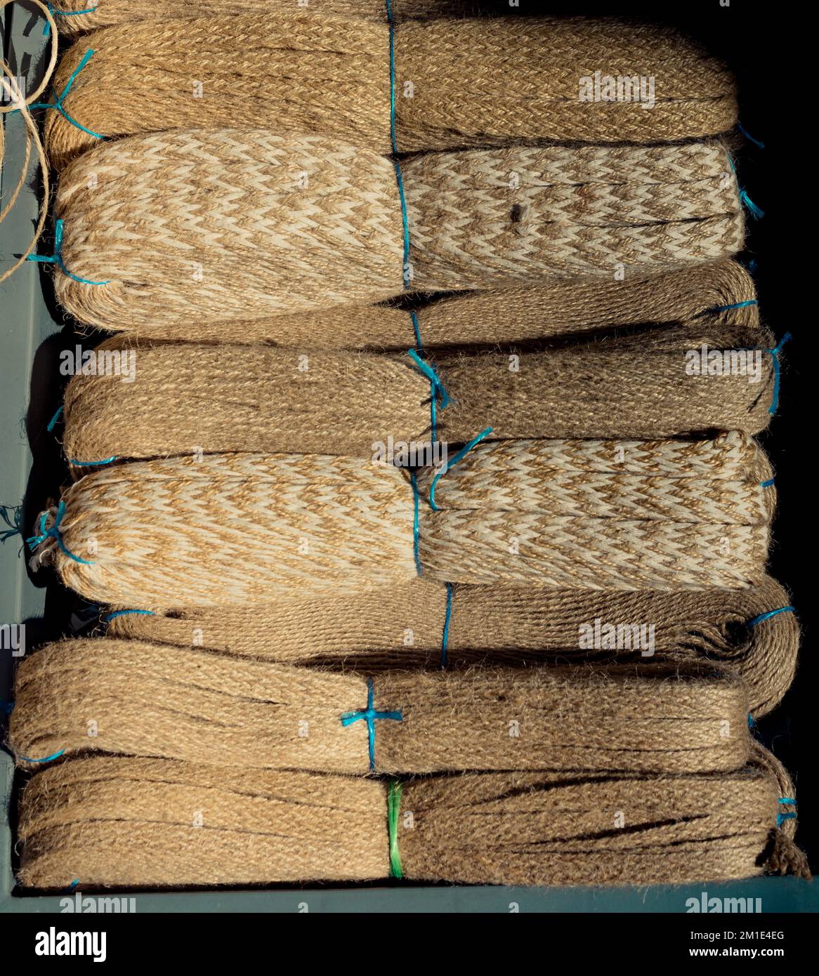 Bundle of linen rope in a market place Stock Photo - Alamy