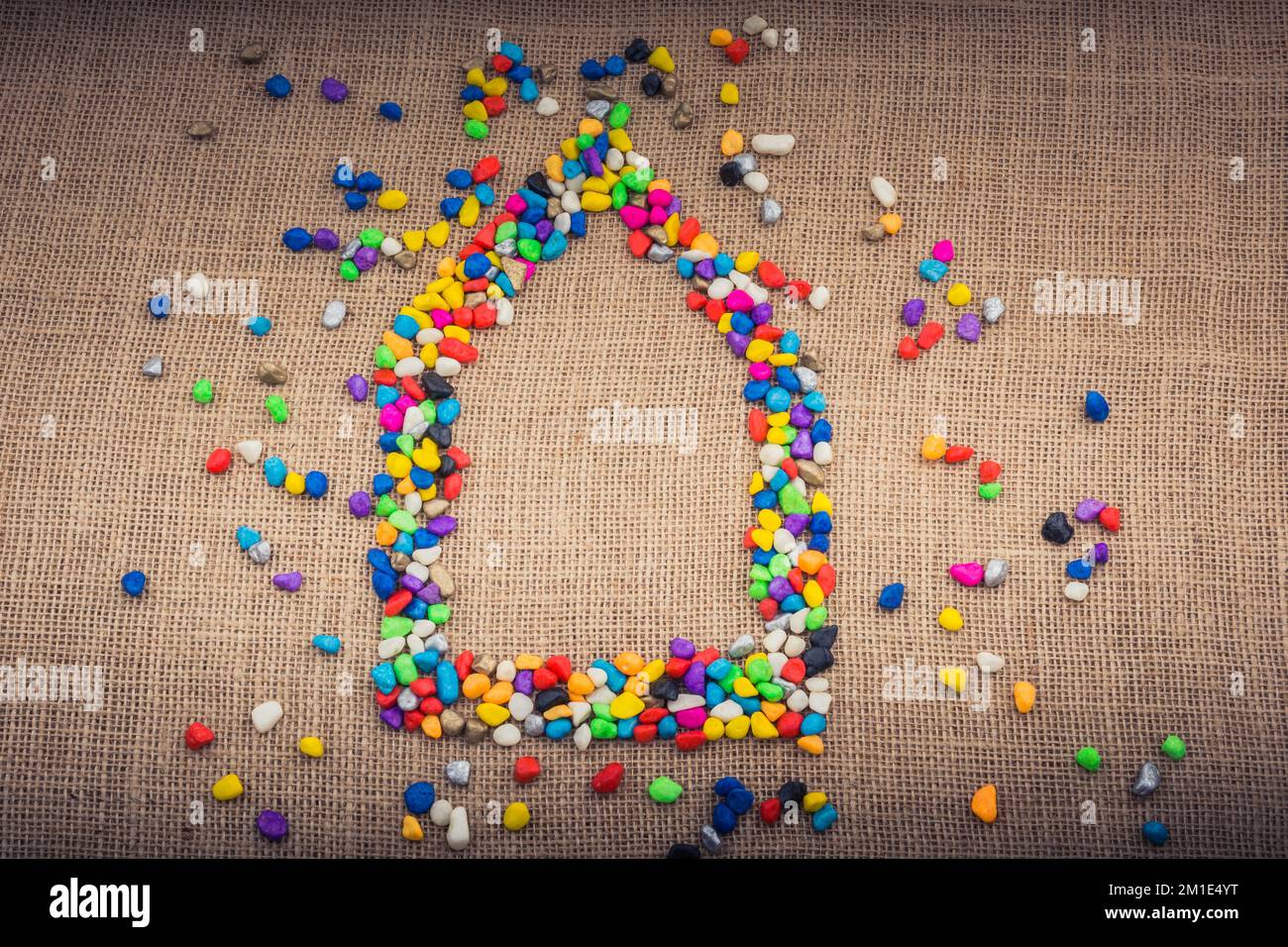 House form shaped by some colorful pebbles Stock Photo - Alamy