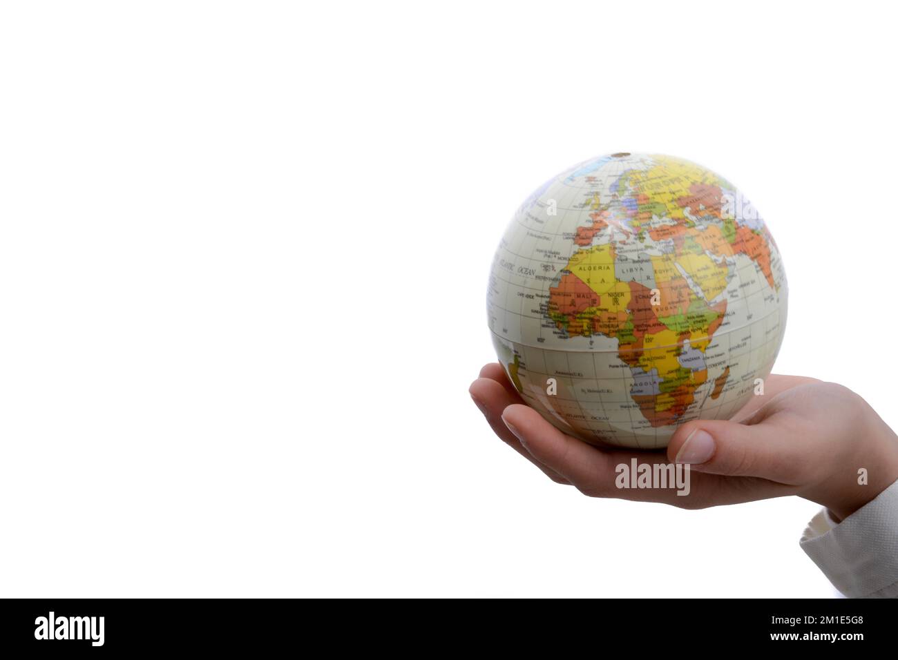 Child holding a small globe in hand on white background Stock Photo - Alamy
