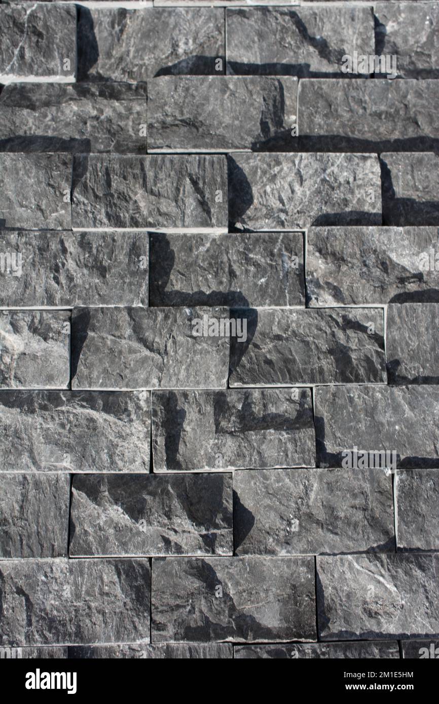 Decorative cubic stone wall as background texture Stock Photo - Alamy