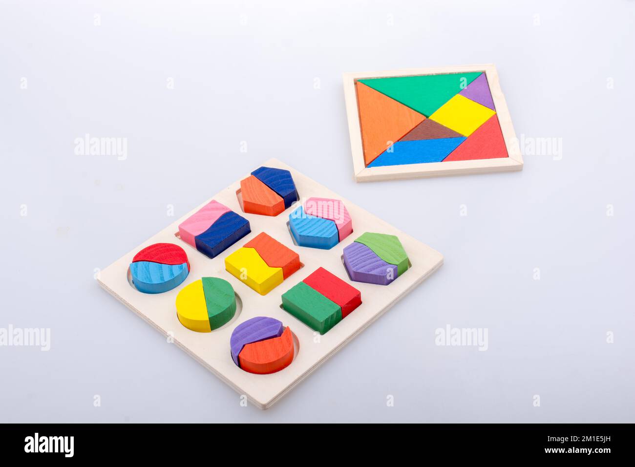 Colorful wooden pieces of a logic puzzle Stock Photo - Alamy