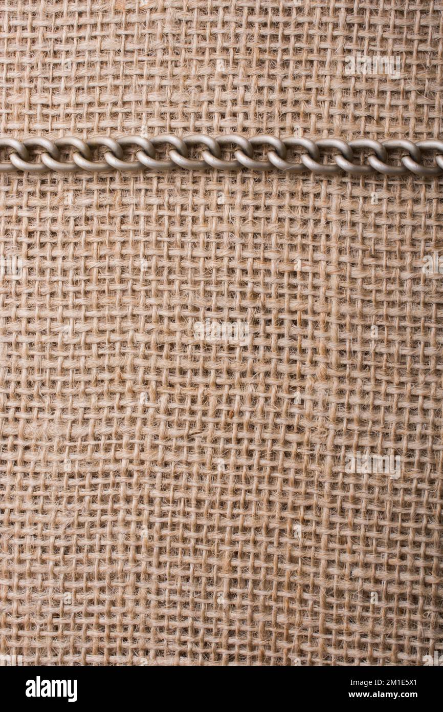 Chain on a linen canvas as a background texture Stock Photo - Alamy