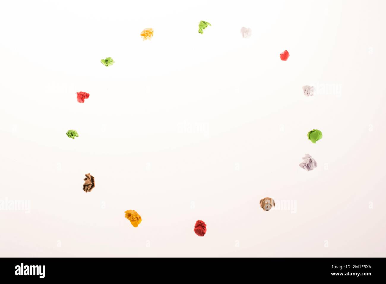 Colorful crumpled papers form a round shape on white background Stock ...