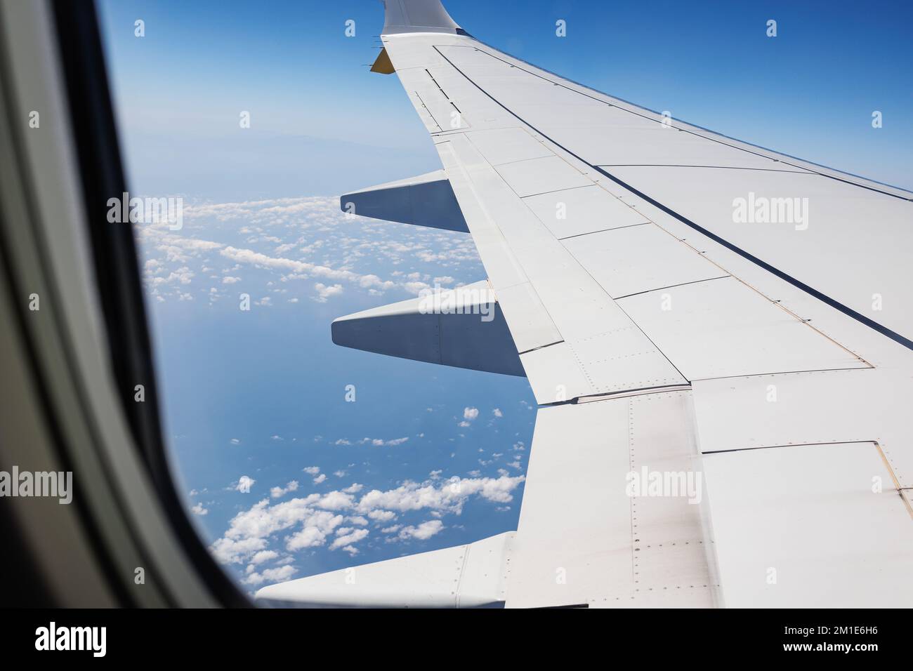 View from Inside an Aircraft: Window of the Cabin, White Airplane Wing ...