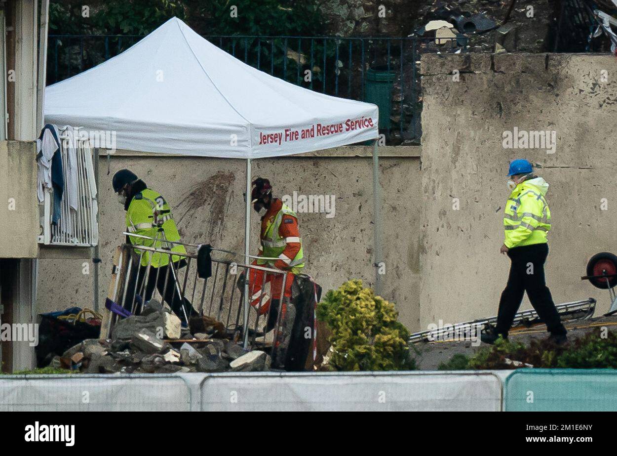 Emergency personnel at the scene of an explosion and fire at a block of ...
