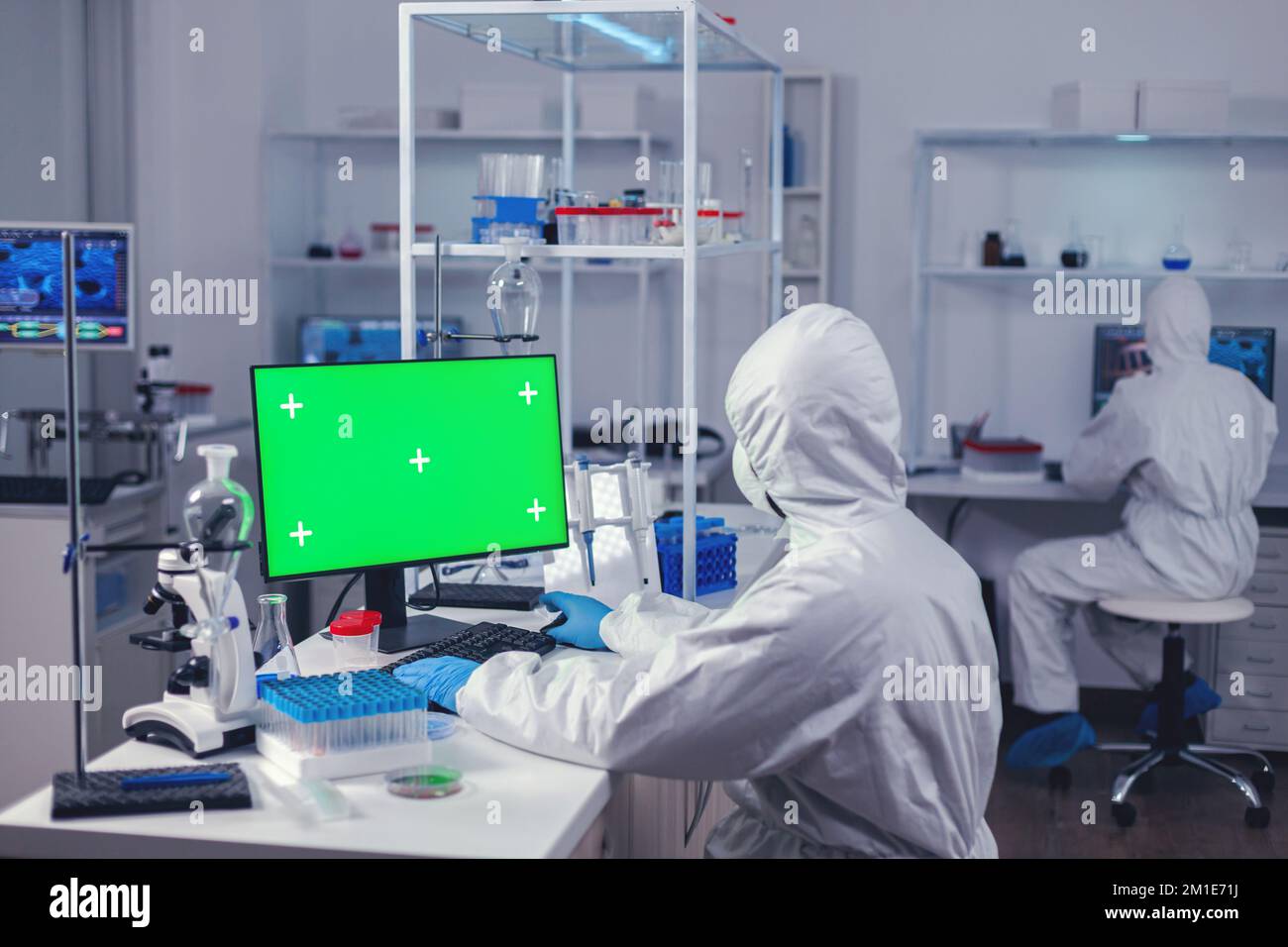 Doctor in protection suit against covid19 delevoping cure using ...