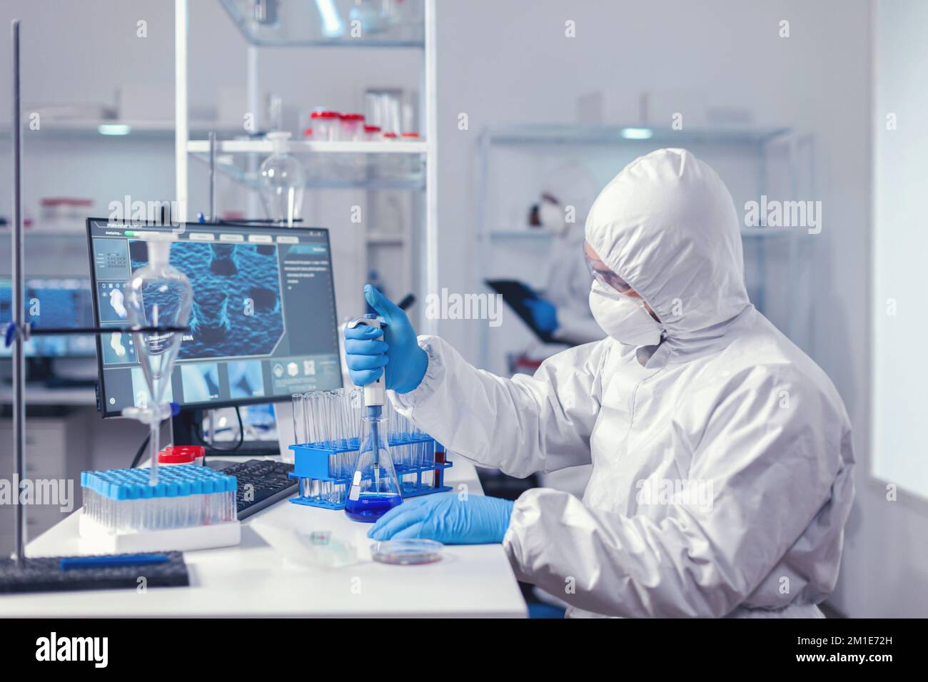Biochemistry engineer conducing coronavirus experiment using automatic ...
