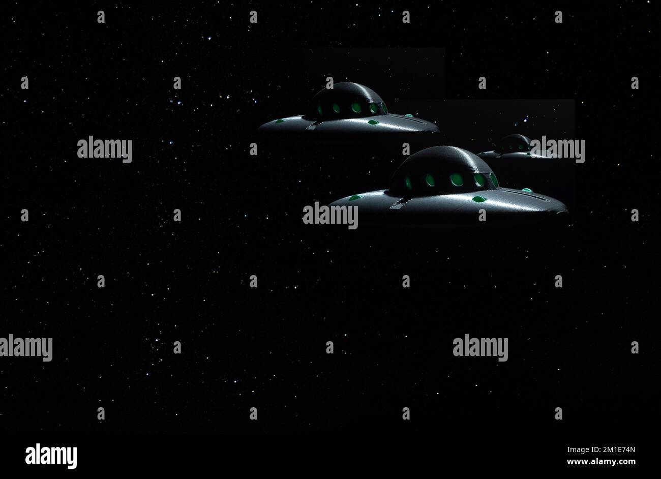 Three flying saucers in formation with stars behind Stock Photo - Alamy