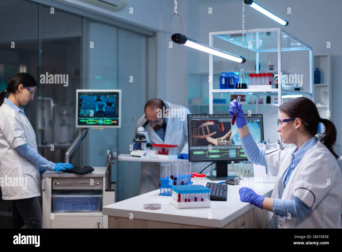 Team of scientific researchers working with professional modern ...