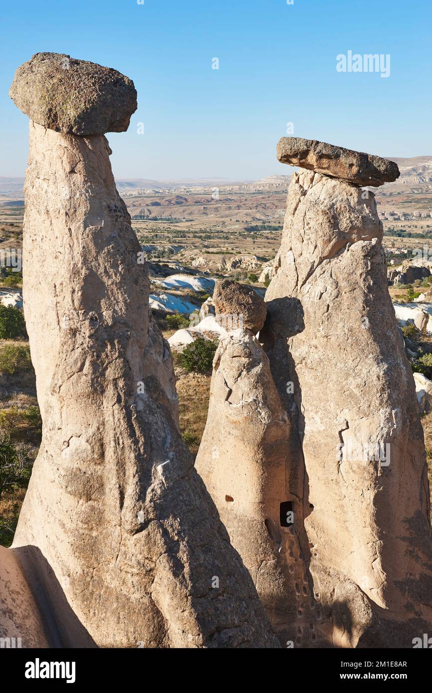Picturesque chimney rock formations in Cappadocia. Urgup village ...