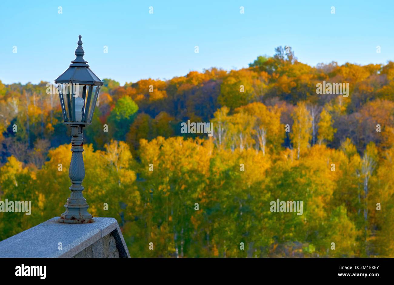 Old fashioned lantern over autumn calm landscape Stock Photo - Alamy