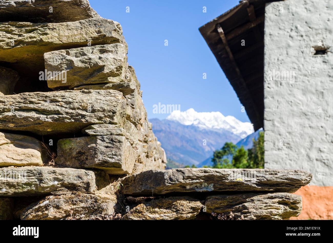 Stone wall, Lumding Himal mountains in the distance Stock Photo - Alamy