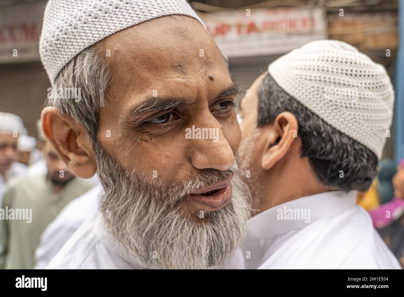 A closeup of Muslims hugging each other after Eid Namaz. Delhi, India ...